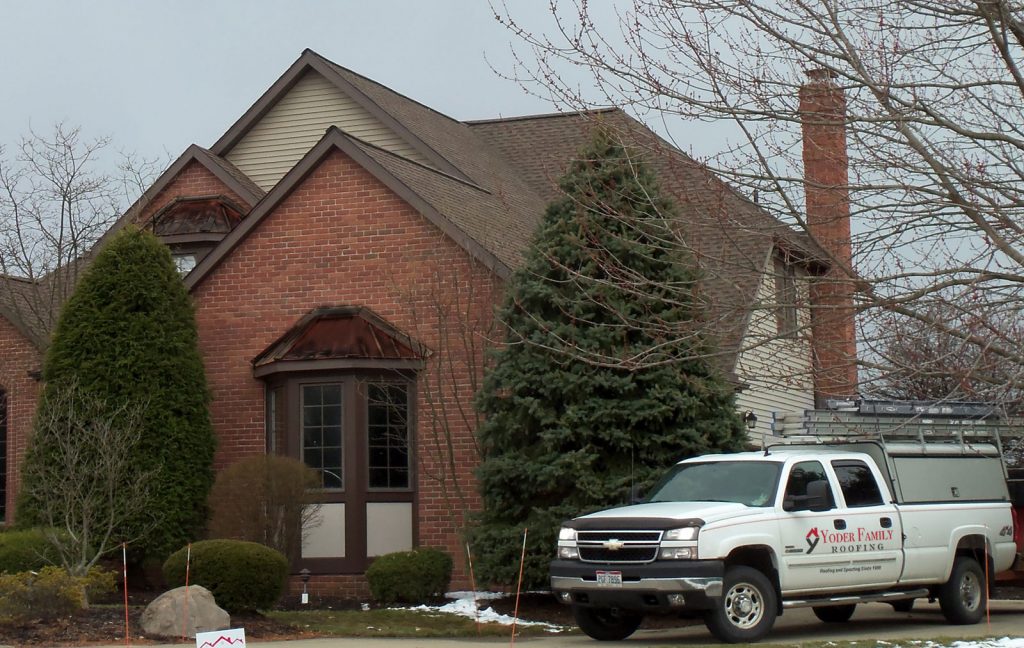 Metal Roofs vs. Asphalt Shingles: Key Differences & Benefits - Yoder Family Roofing